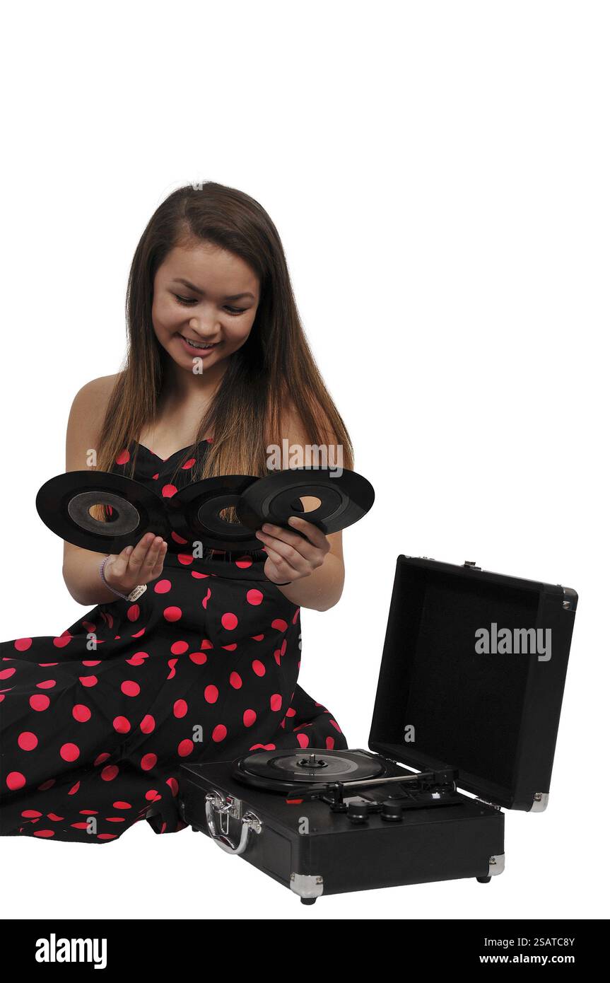 Beautiful woman with vintage 45 single record Stock Photo - Alamy