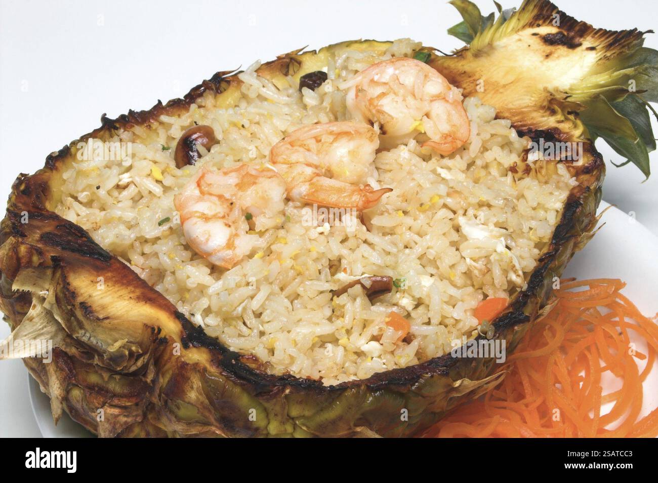 Japanese pineapple shrimp fried rice in a carved out pineapple Stock ...
