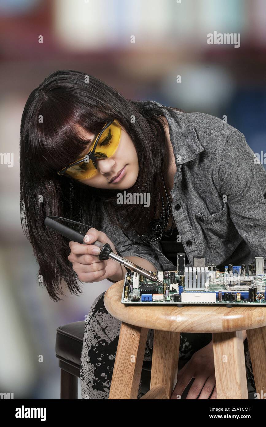 Beautiful woman repair soldering a printed circuit board Stock Photo ...