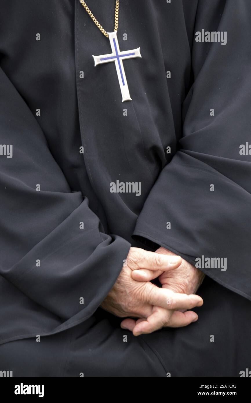 Religious Community Greek Orthodox Church, Munich. Dignitary with cross ...