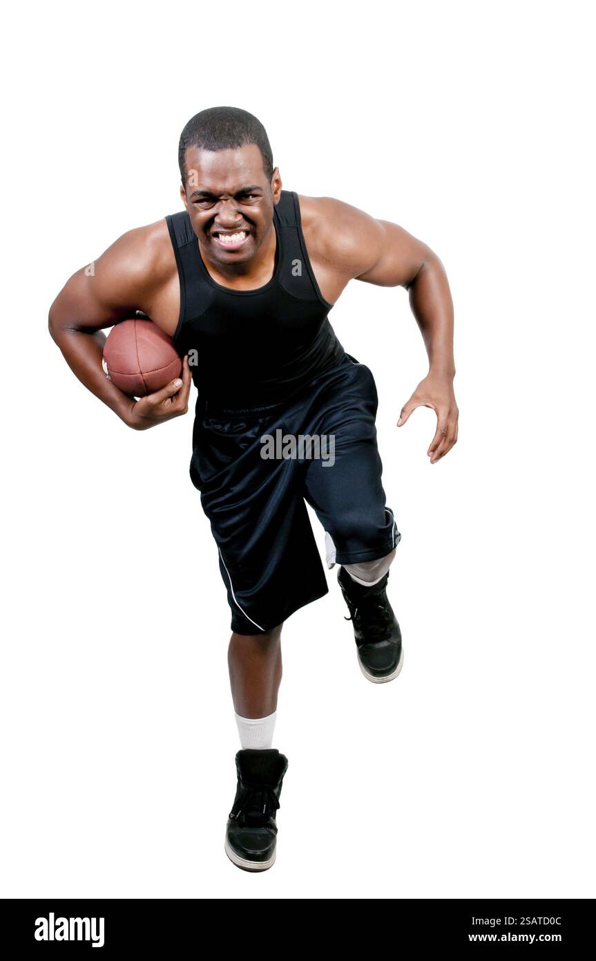 Black African American man playing a game of football Stock Photo - Alamy