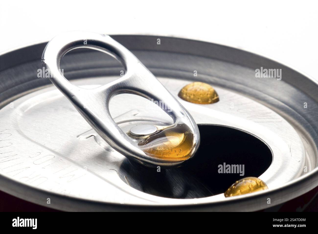 A Cola Drip on the top of a soft drink can Stock Photo - Alamy