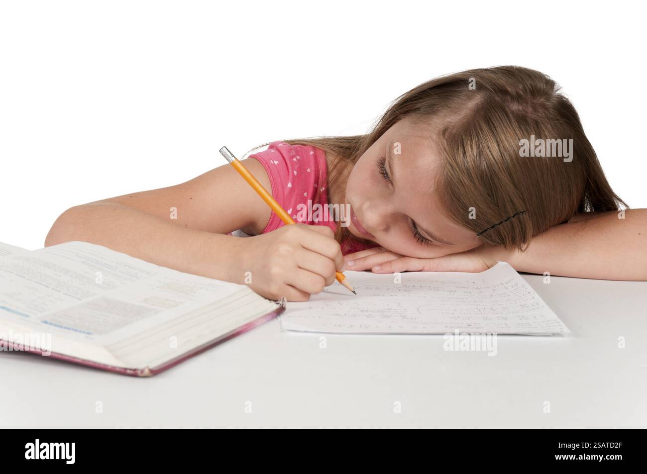 Pretty little girl doing her school homework Stock Photo - Alamy