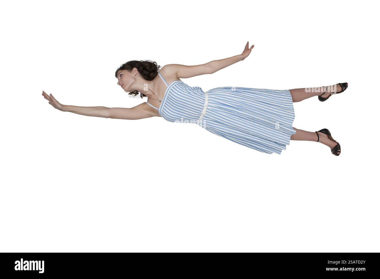 Beautiful young woman floating in the air Stock Photo - Alamy