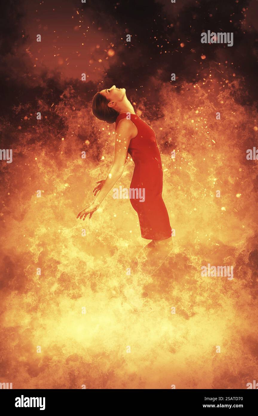 Beautiful woman standing in the midst of a fire Stock Photo - Alamy