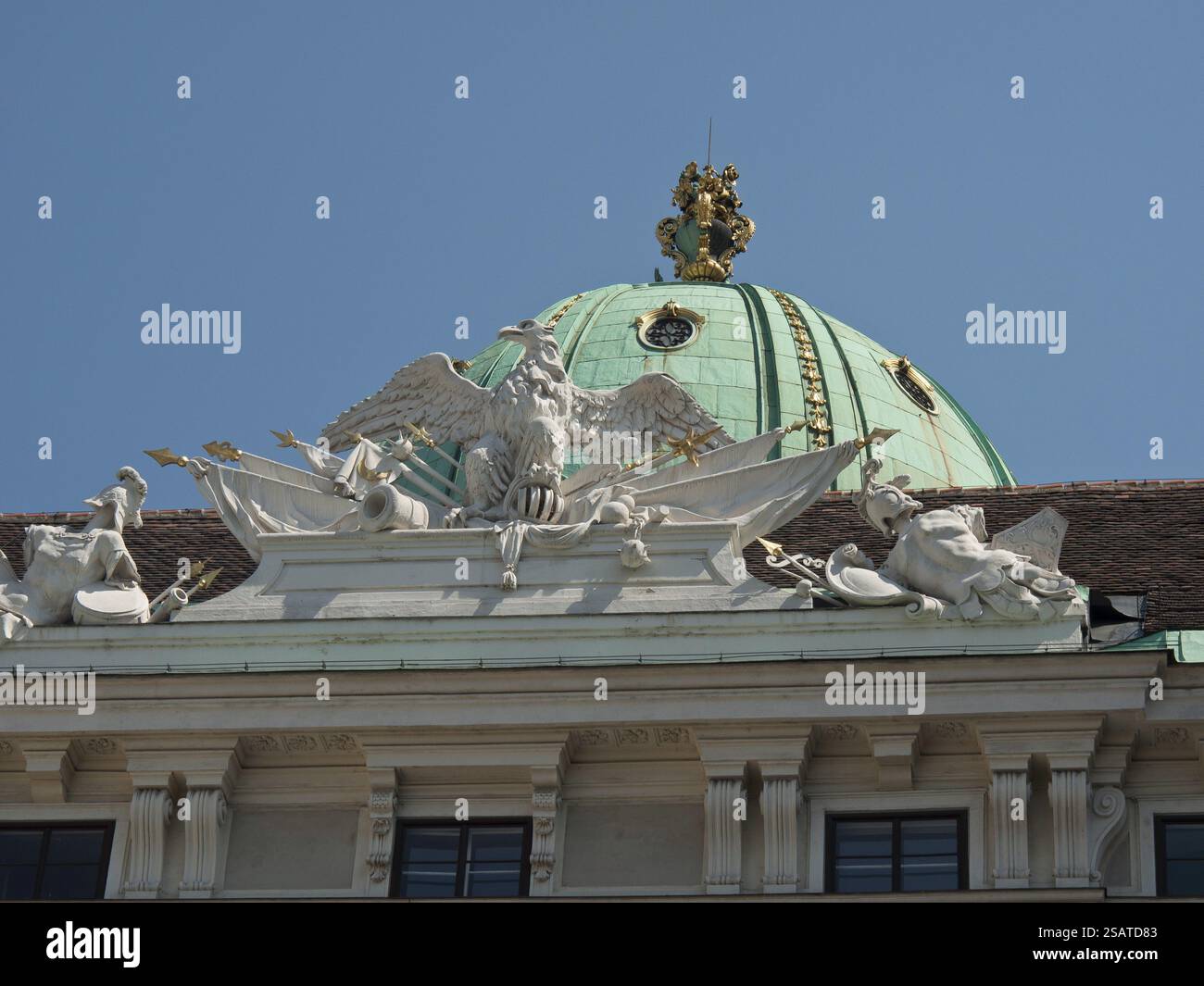 Historic dome with green lace and decorated sculptures, including an ...