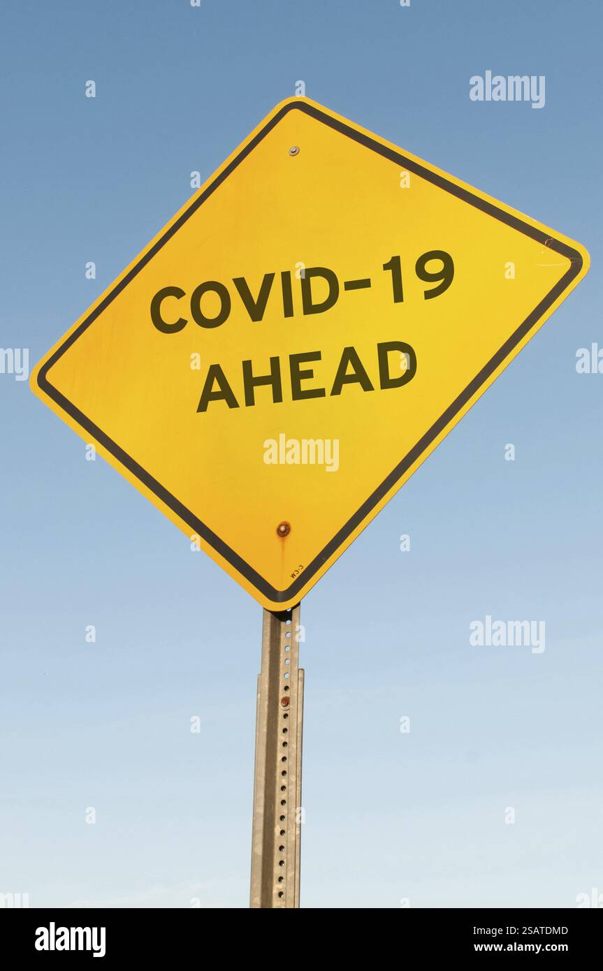 Road sign showing caution that a covid 19 pandemic is aheads Stock ...