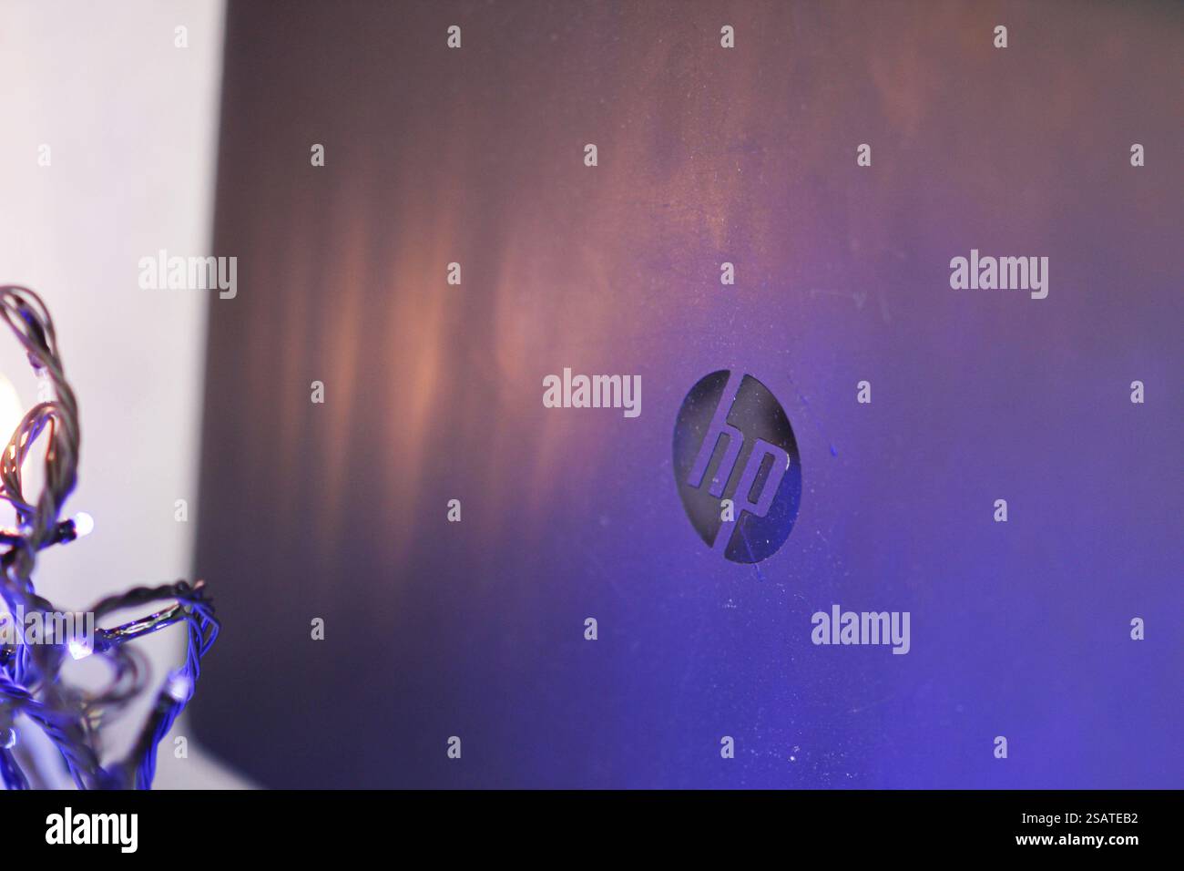 HP laptop with a metallic finish and purple light effects Stock Photo ...
