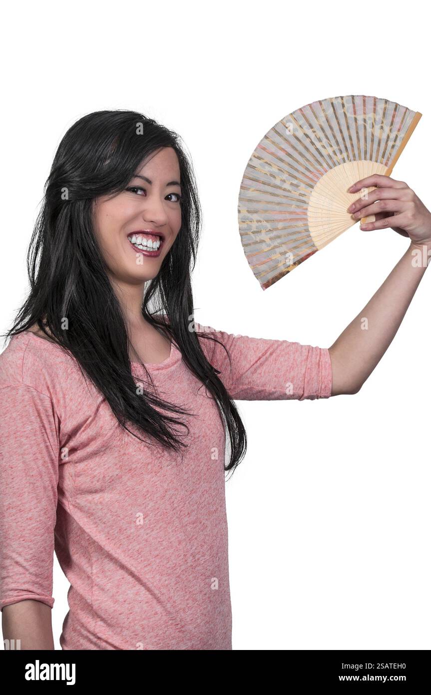 Beautiful Asian woman with an oriental fan Stock Photo - Alamy