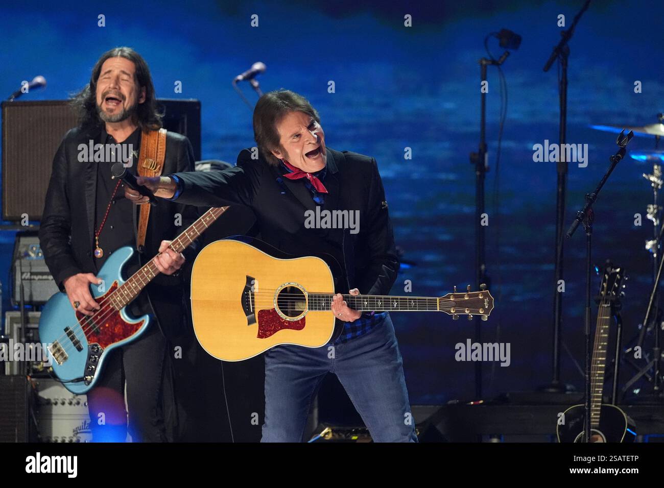 Sven Pipien, left, of The Black Crowes performs with John Fogerty ...