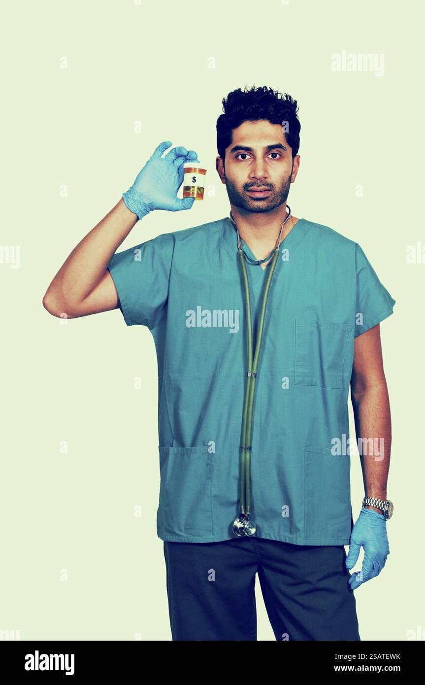 Doctor holding prescription medication in his office Stock Photo - Alamy