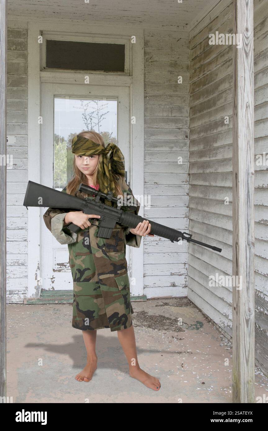 Beautiful little girl soldier with a M16 rifle Stock Photo - Alamy