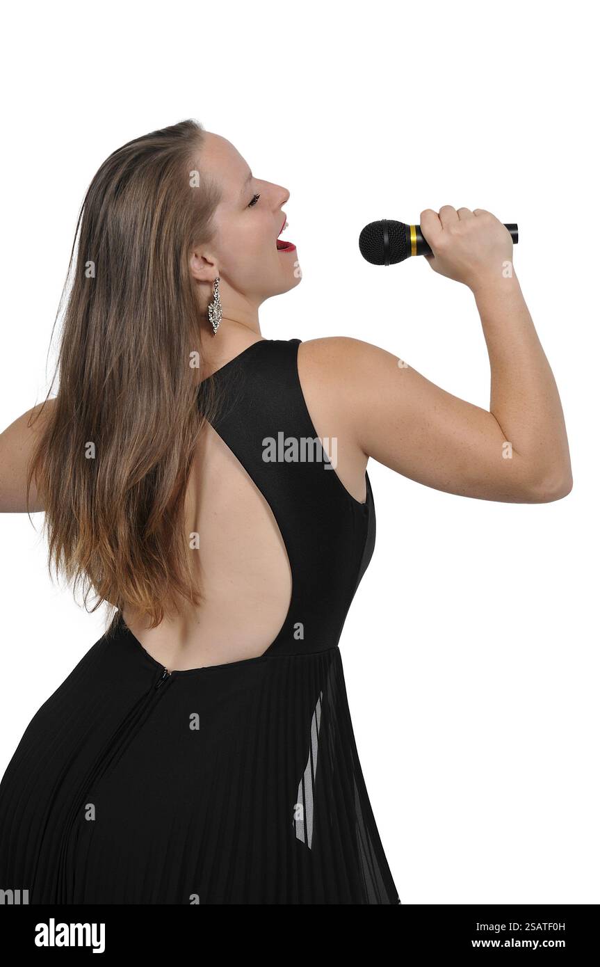 Beautiful woman singer performing at a concert Stock Photo - Alamy