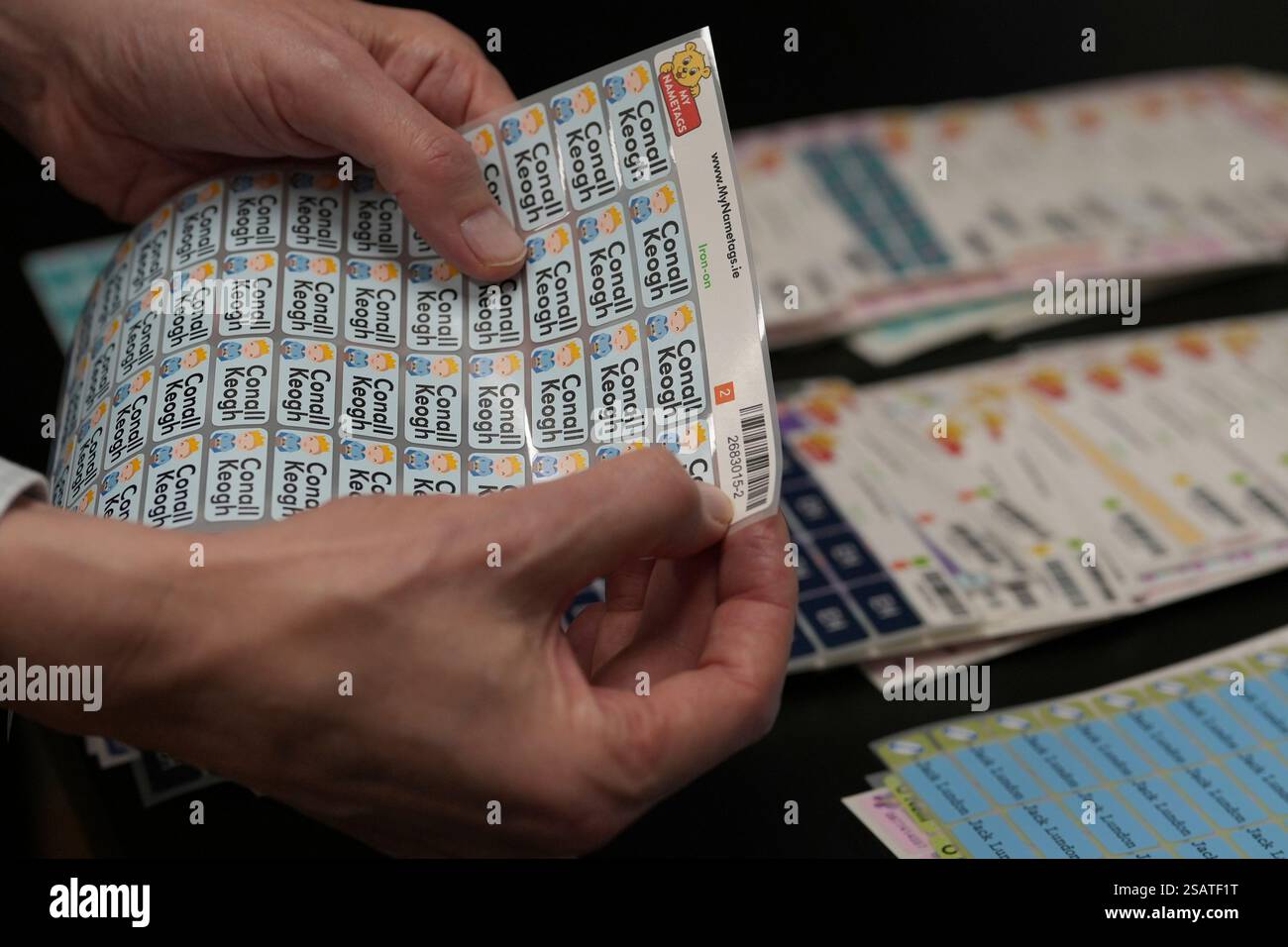 Lars Andersen founder of 'My Nametags' holds up school children labels ...