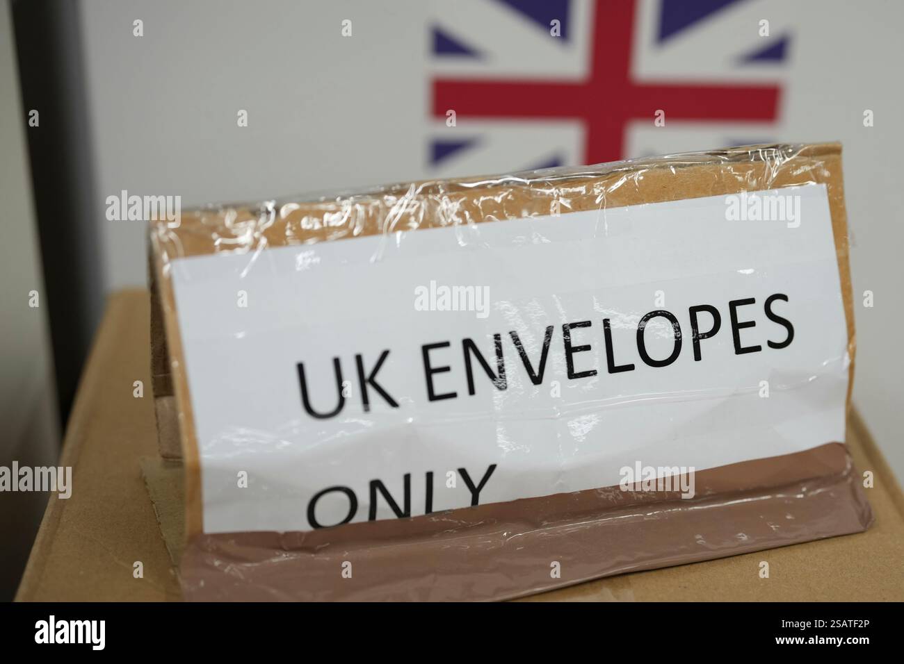 A sign for UK Envelopes only waits for packets of envelops containing ...