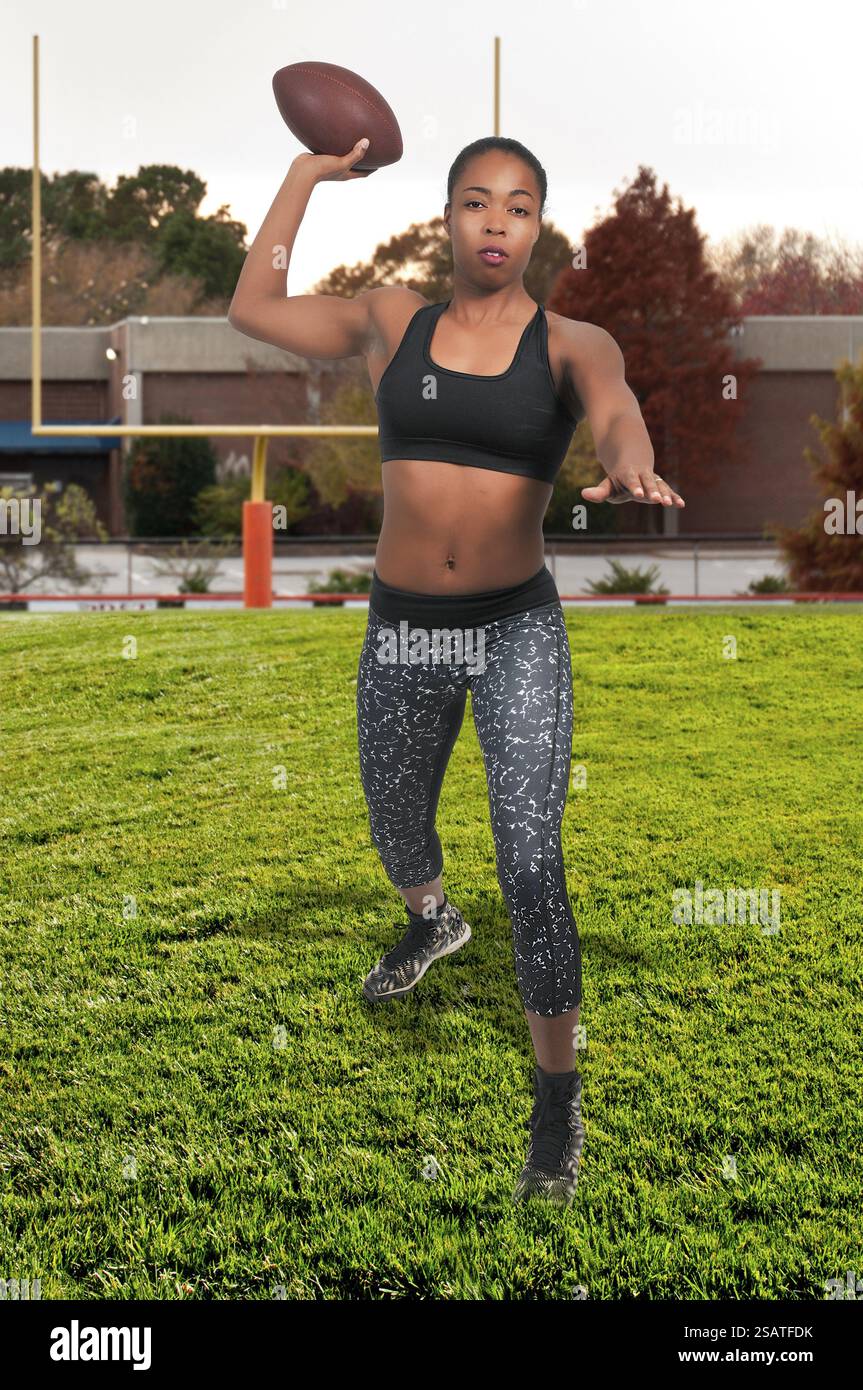 Beautiful young woman quarterback while throwing a football Stock Photo ...