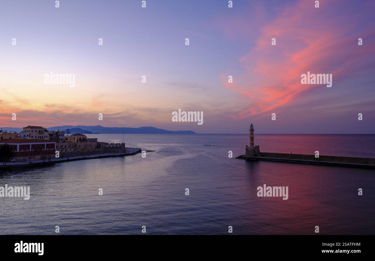 Chania Venetian harbour with lighthouse at sunset, Crete Stock Photo ...