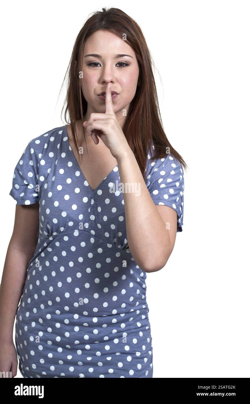 A woman saying be quiet by saying shhh Stock Photo - Alamy