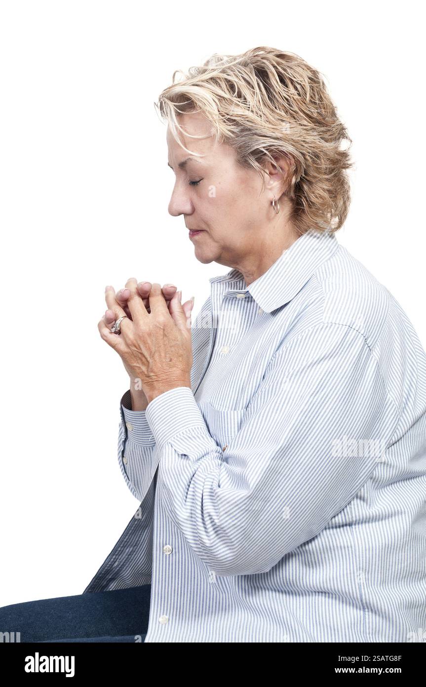 Beautiful Christian woman in a deep prayer Stock Photo - Alamy