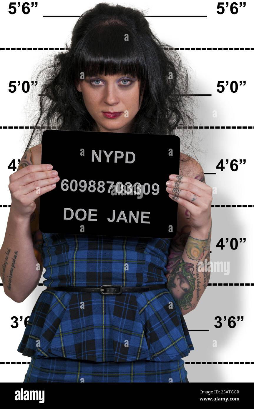 Mugshot of a beautiful young woman criminal Stock Photo - Alamy