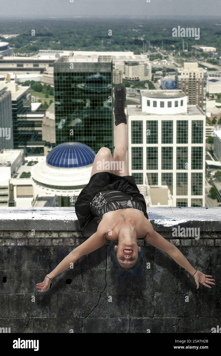 Beautiful woman balancing or floating upside down Stock Photo - Alamy