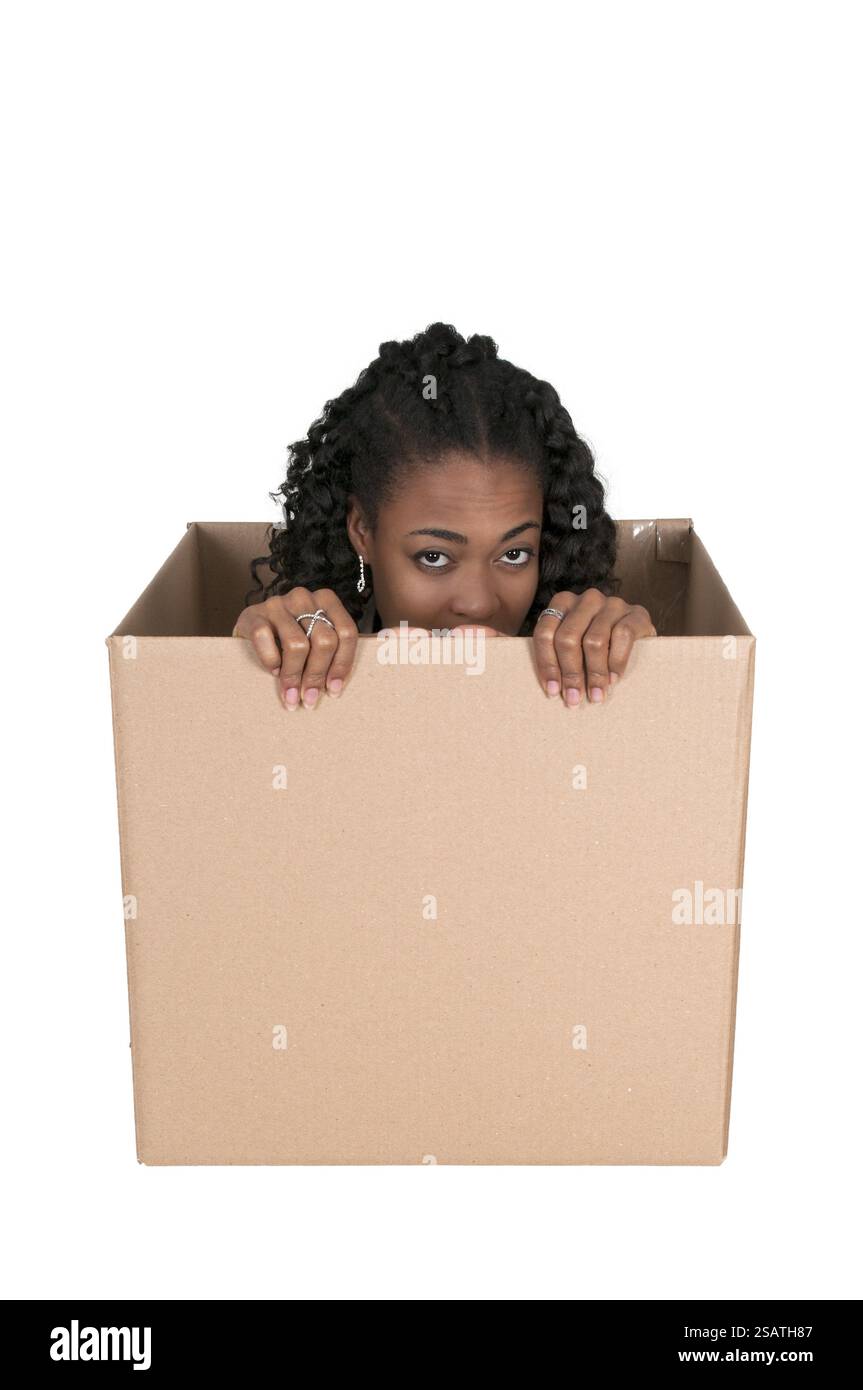 Beautiful black woman thinking while standing beside a box Stock Photo ...
