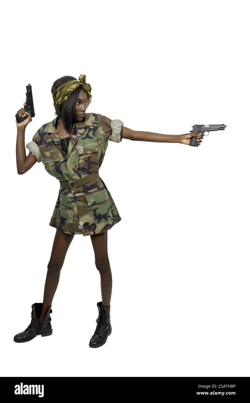 Gun toting beautiful young woman soldier with pistols Stock Photo - Alamy