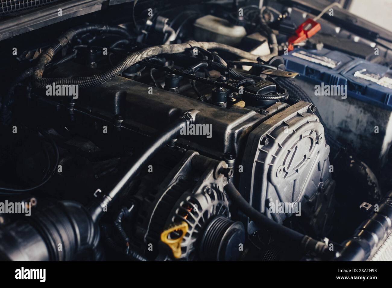 Close-up of a car's engine with visible components and wiring, for ...