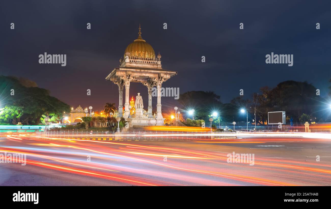 Statue of Chamarajendra Wadiyar illuminated in night time in Mysore ...