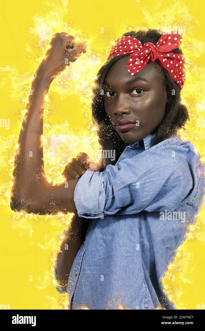 Beautiful woman dressed as the iconic Rosie the Riveter Stock Photo - Alamy