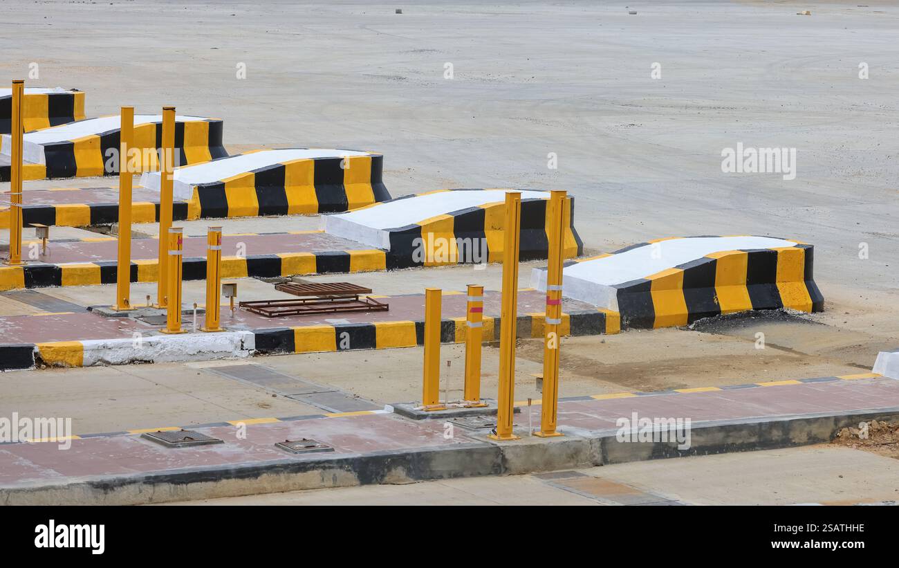 Road dividers painted yellow and black at a newly constructed toll ...