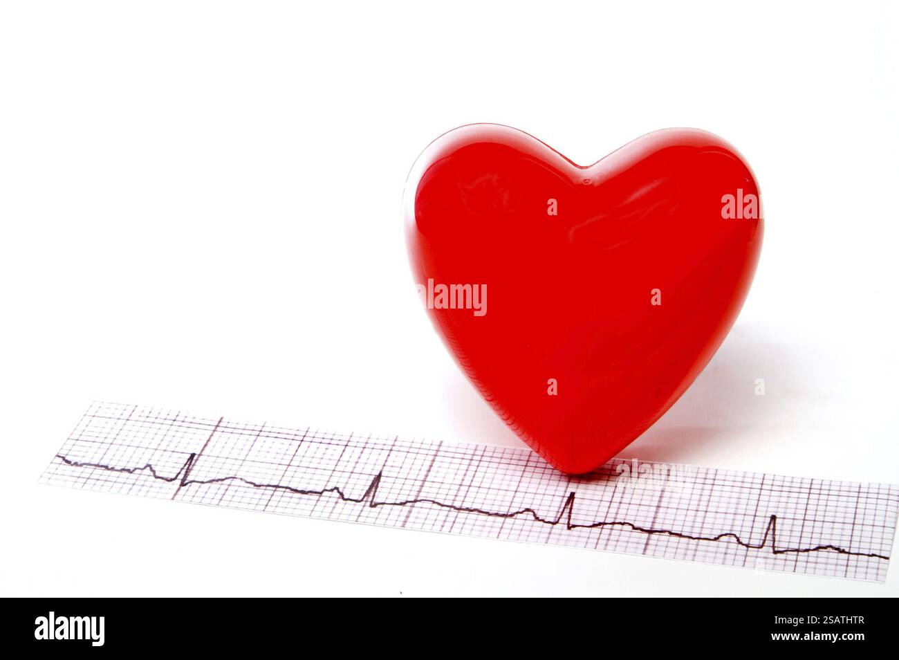 A heart shape and an EKG strip Stock Photo - Alamy