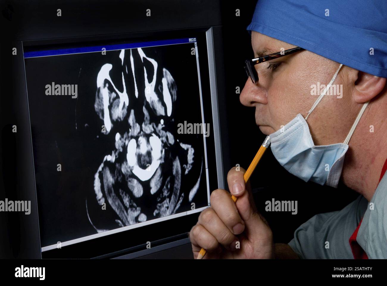 A medical doctor examining a CTT Scan Stock Photo - Alamy