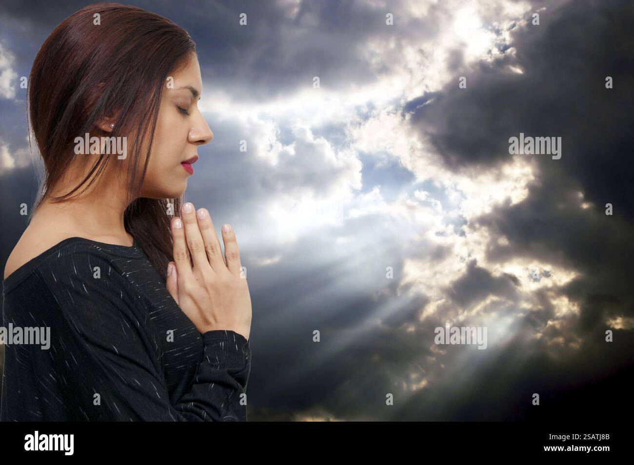 Beautiful Hispanic Latino Christian woman in deep prayer Stock Photo ...