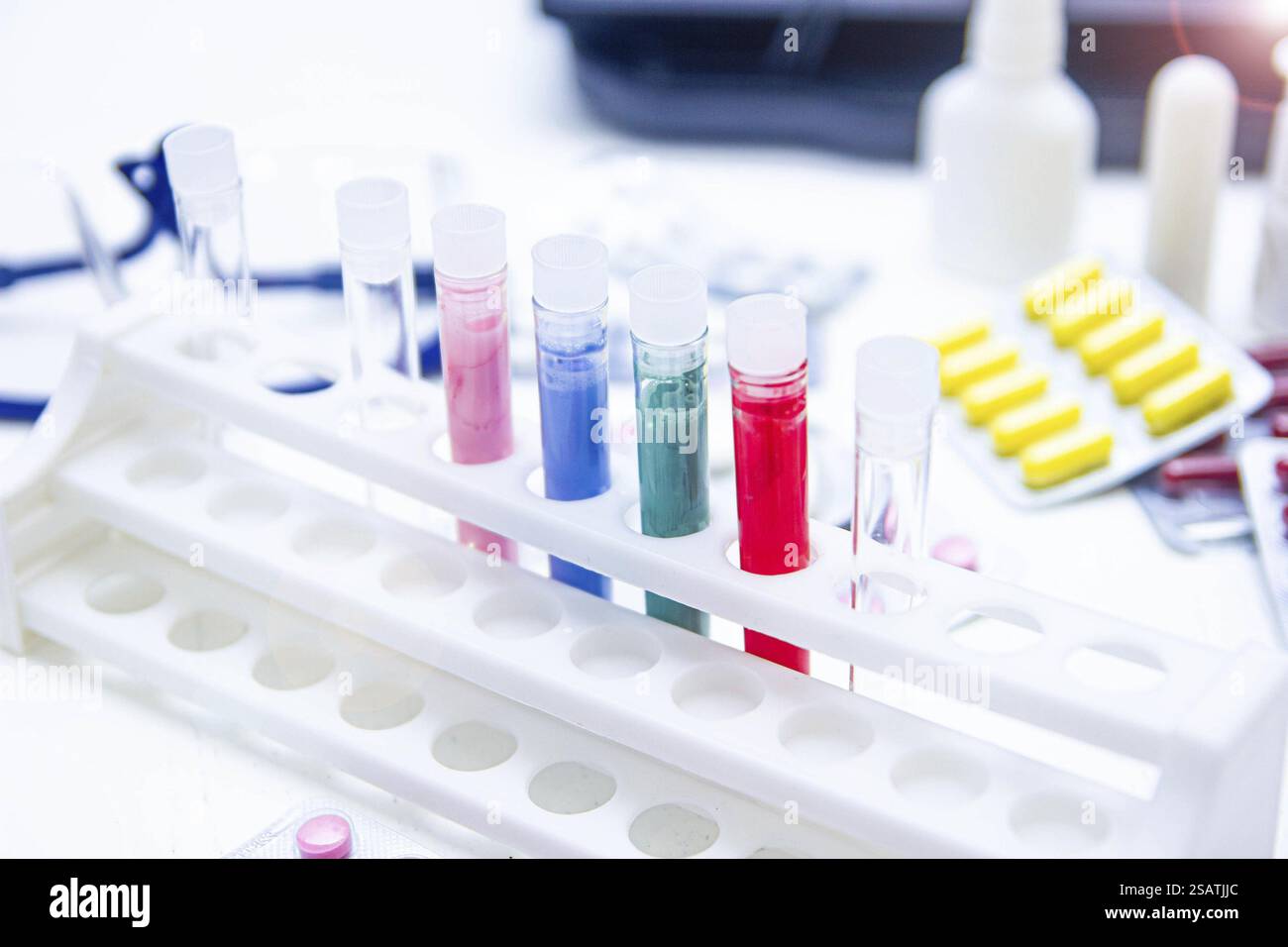 Colorful test tubes and medicine on a bright laboratory table Stock ...