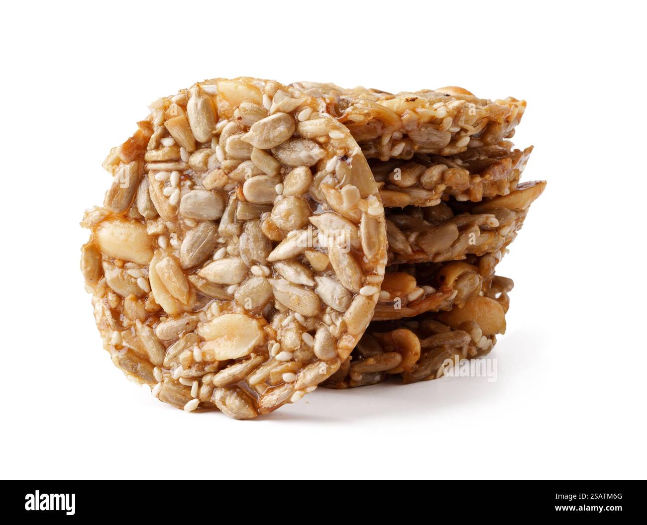 Crunchy seed snacks stacked neatly on a white background showcasing ...