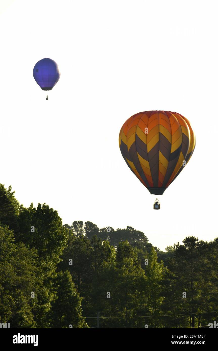 Hot air balloon rising above the horizon Stock Photo - Alamy