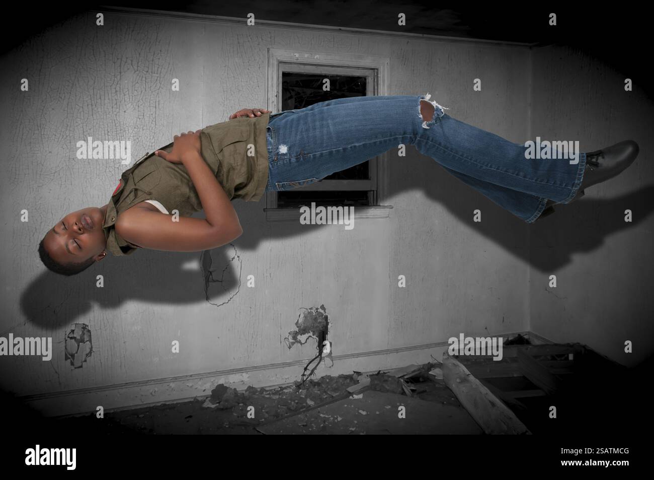 Beautiful young black woman floating in the air Stock Photo - Alamy