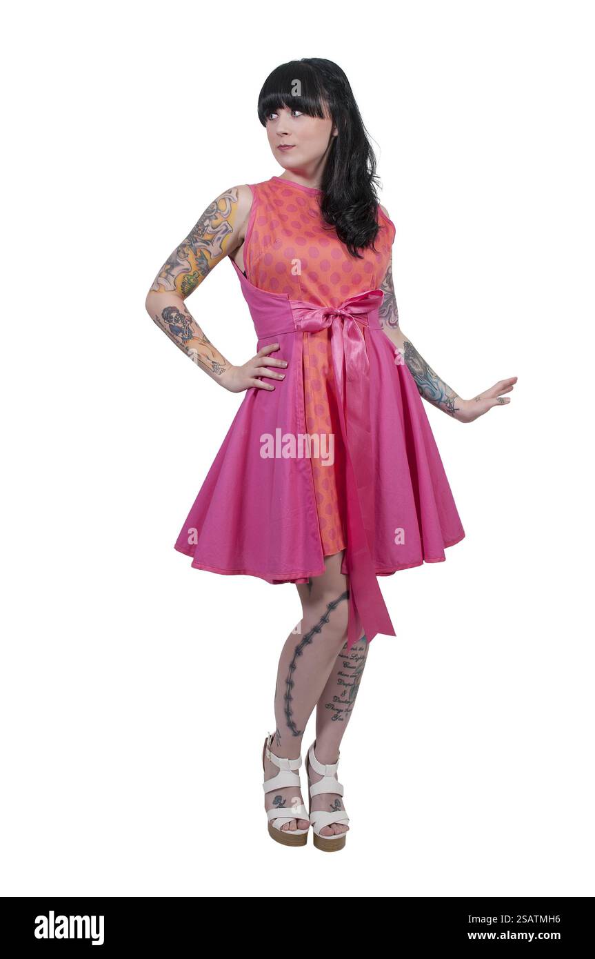 Beautiful young attractive woman modeling her dress Stock Photo - Alamy