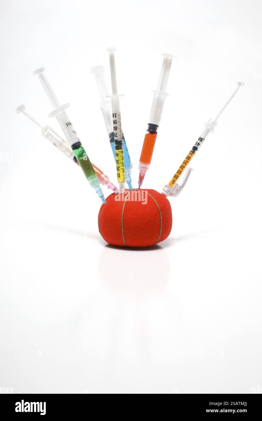 A batch of medical syringes in a pin cushion Stock Photo - Alamy