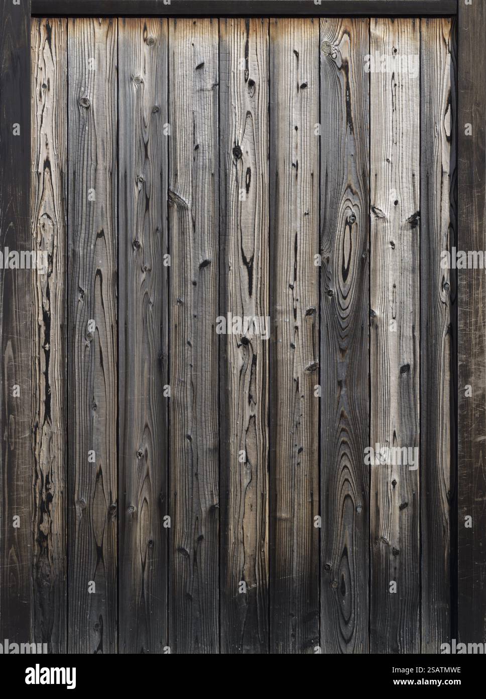 Rustic dark texture of faded burnt Japanese cedar wood boards exterior ...