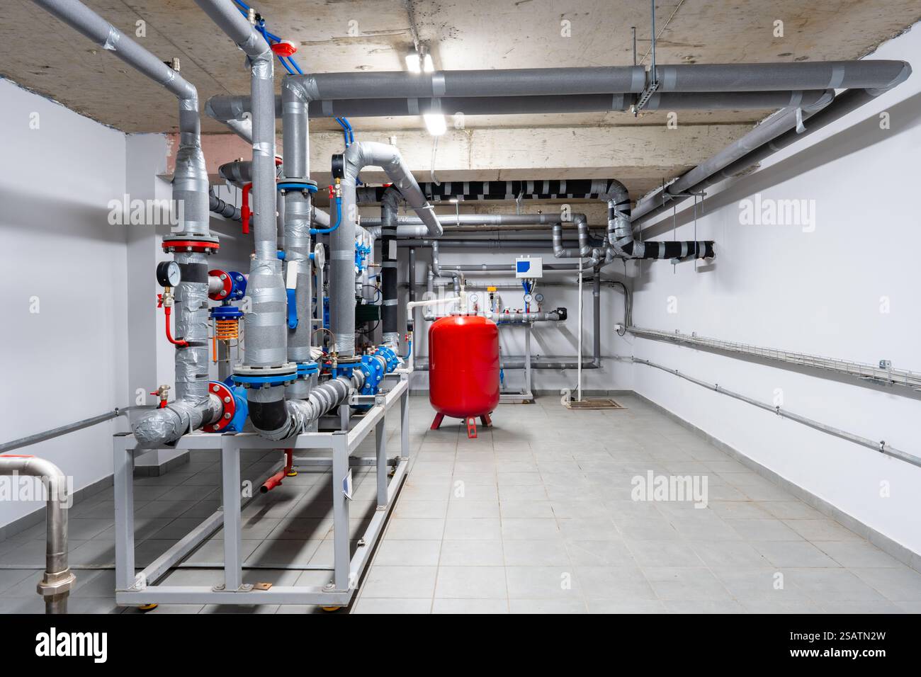 Industrial plumbing system in a modern facility, featuring pipes ...