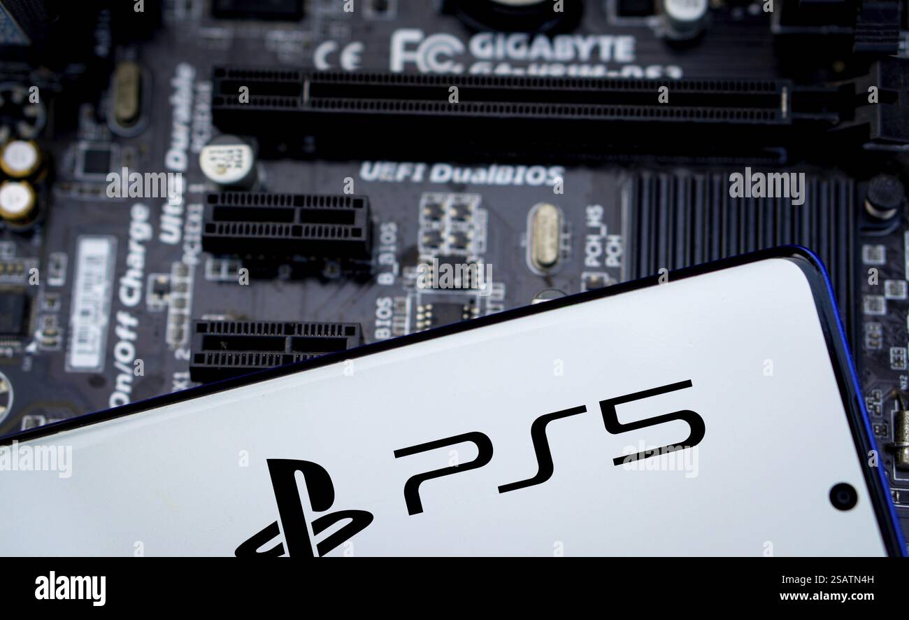 Person holding cellphone with logo of video gaming platform PlayStation ...