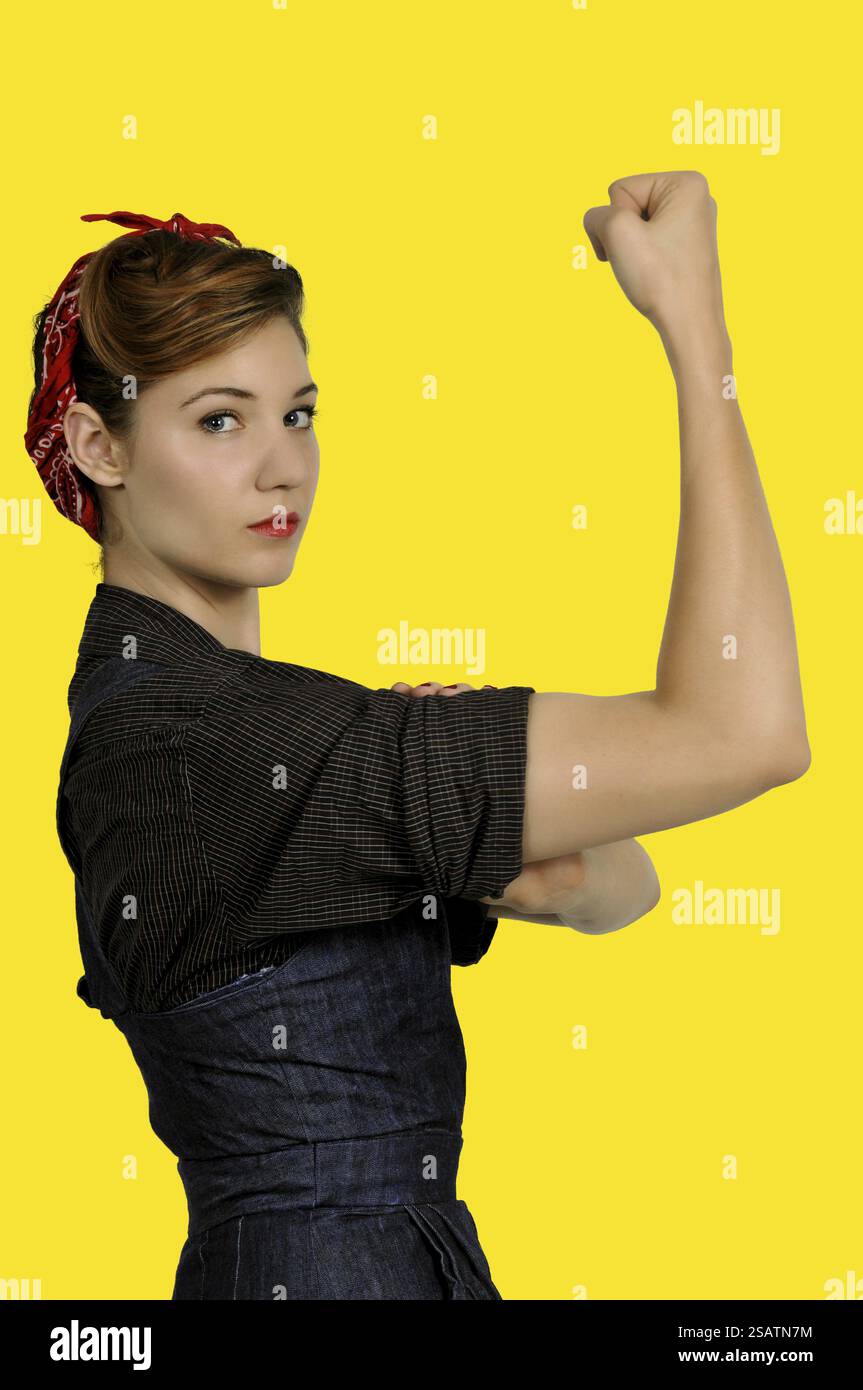Beautiful woman dressed as the iconic Rosie the Riveter Stock Photo - Alamy