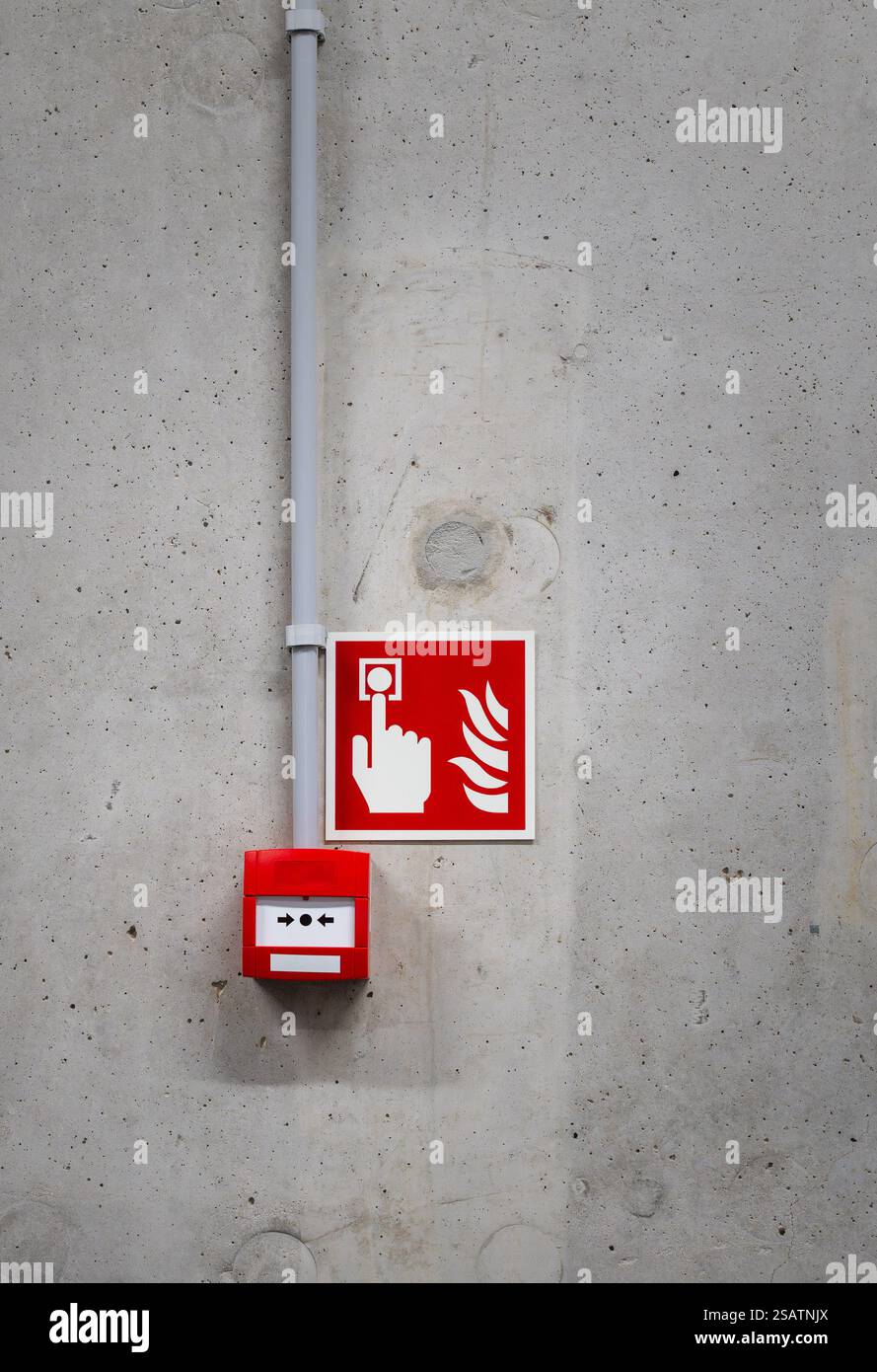 Fire alarm red button sign concrete wall emergency alarm office space ...
