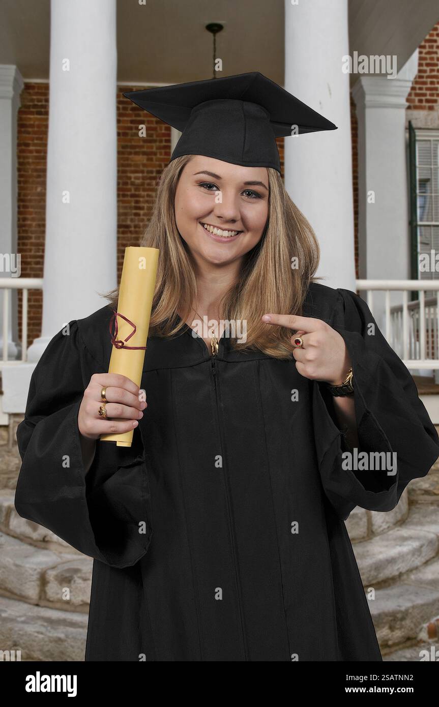 Young woman in her graduation robes Stock Photo - Alamy