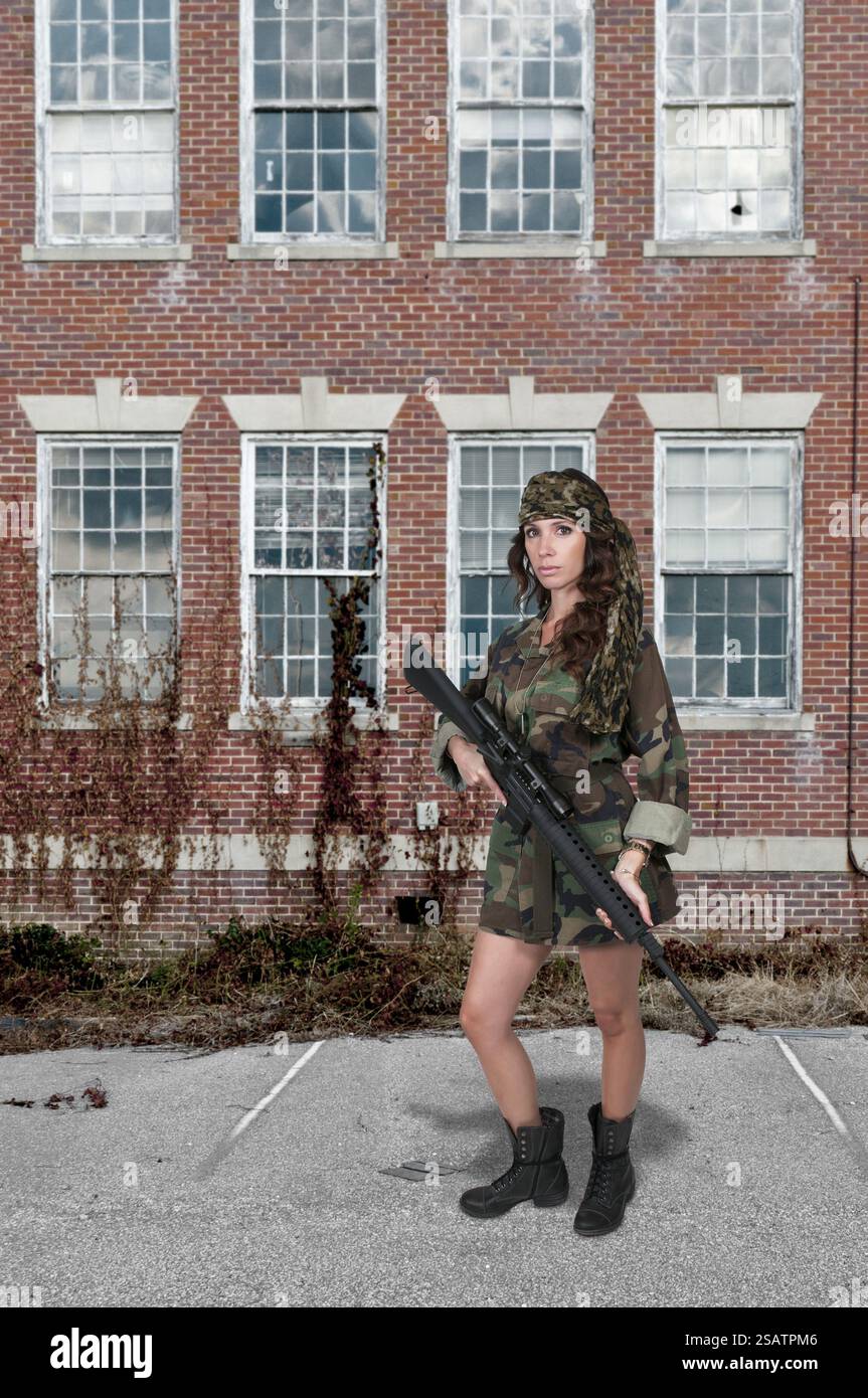 Beautiful young woman soldier with a M16 rifle Stock Photo - Alamy