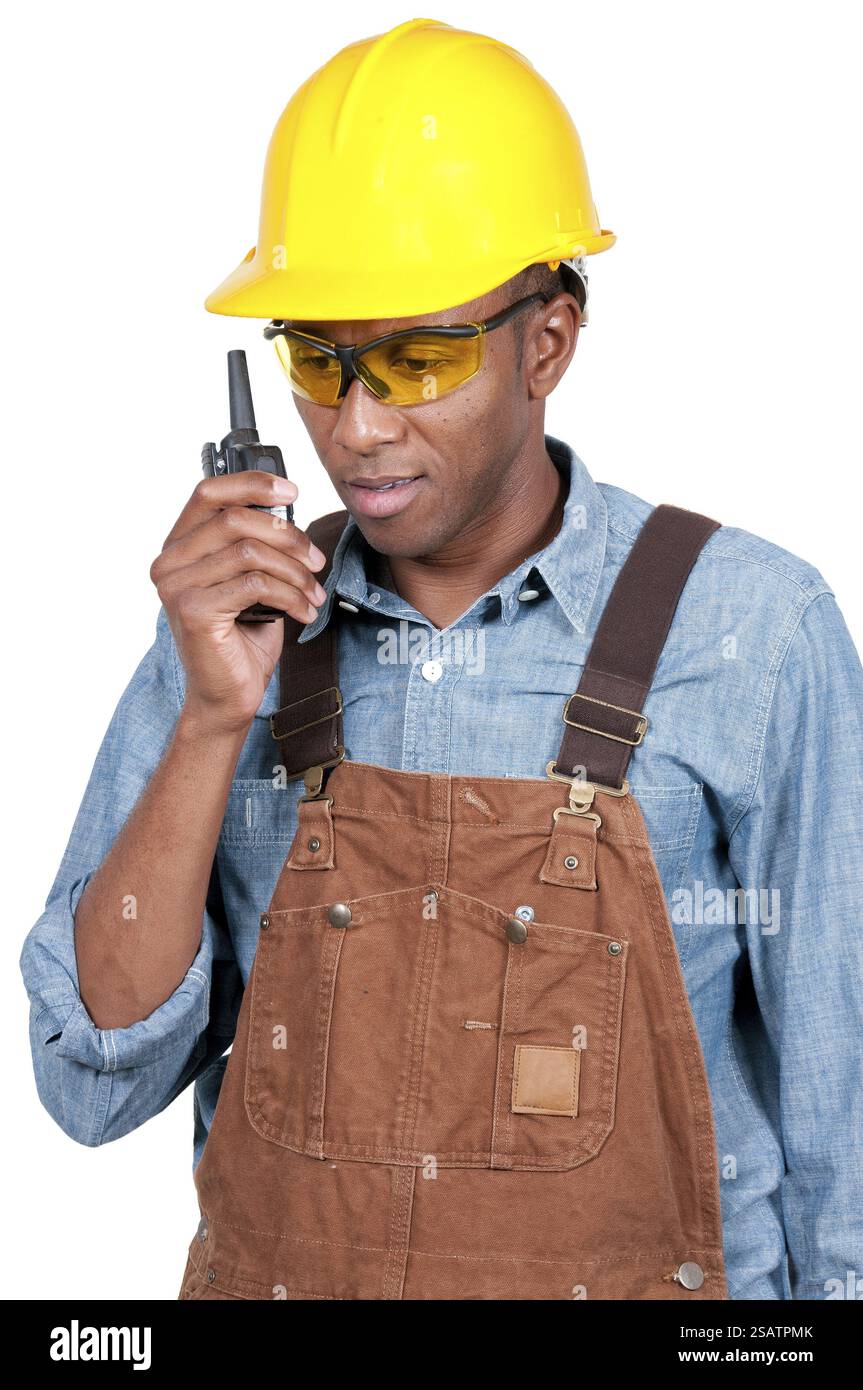 Handsome black man construction worker talking on a walkie talkie Stock ...