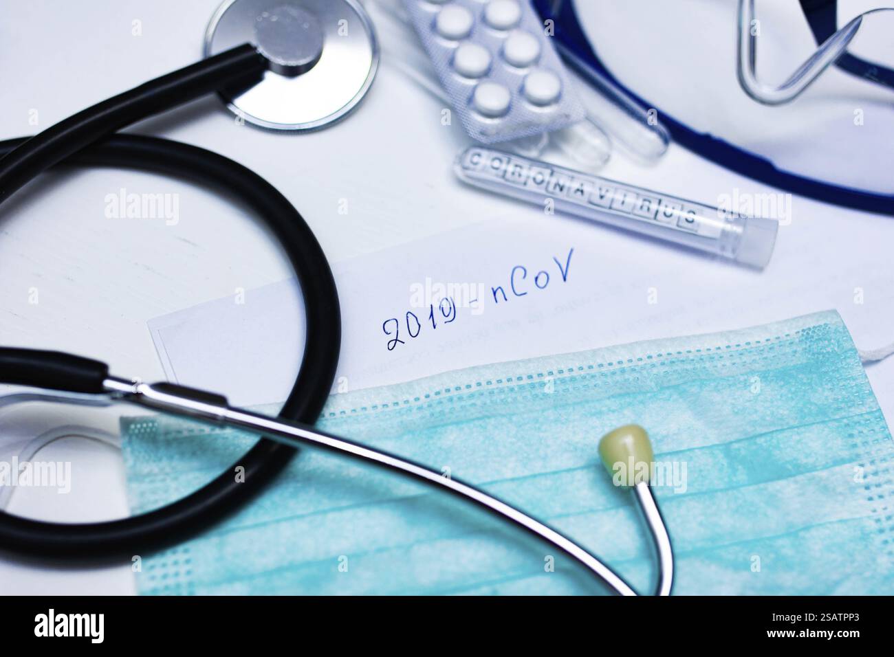 Stethoscope, mask, test tube labeled 2019 nCoV on a table Stock Photo ...