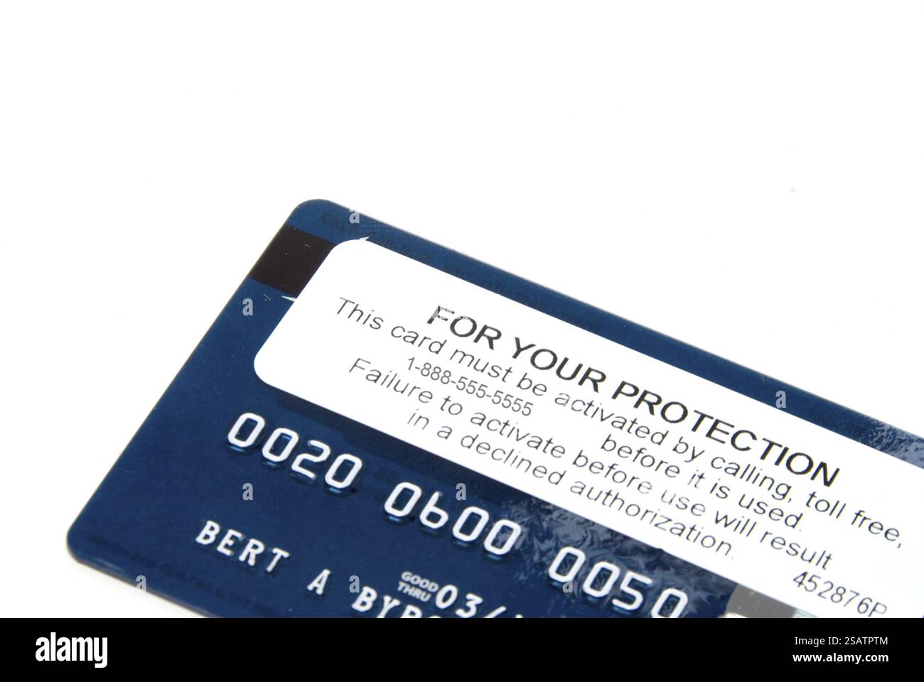 A brand new credit card with an ativation sticker Stock Photo - Alamy